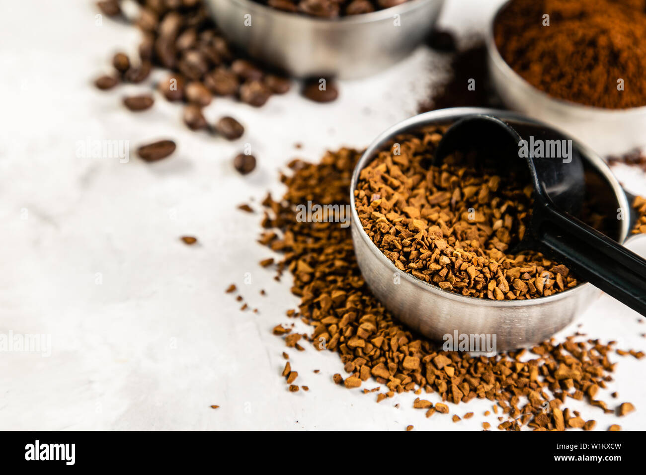 Coffee concept - beans, ground, instant, capsules, marble background ...