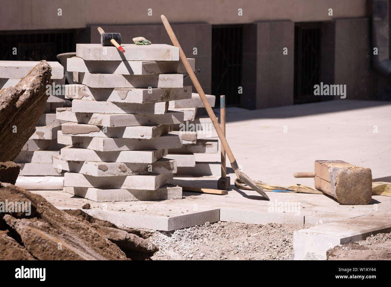 Description: the process of laying paving stone on the street Stock ...
