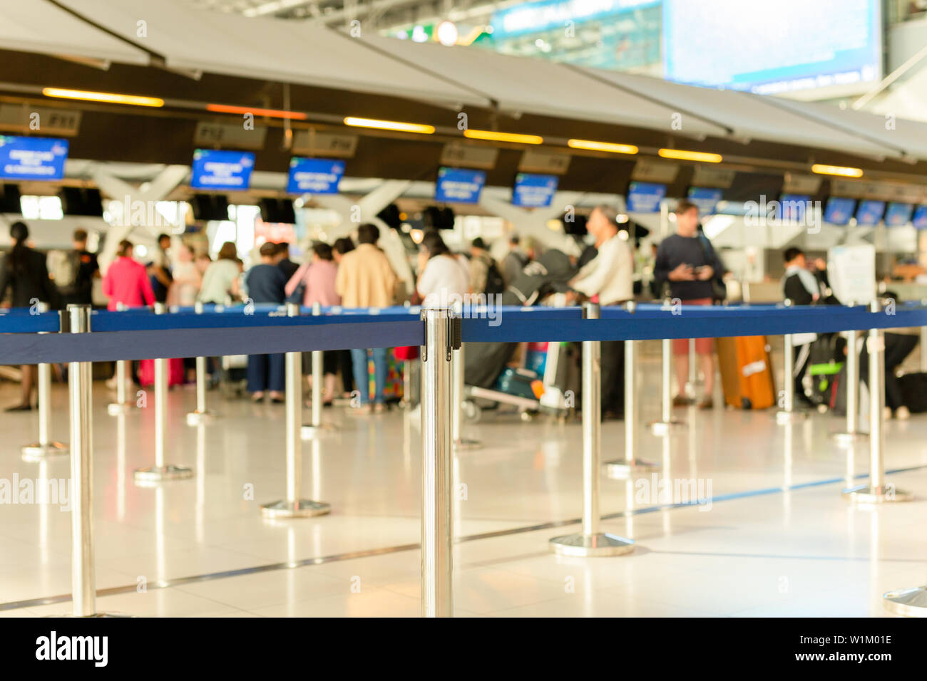 Passengers check-in line at the airport on vacation Stock Photo - Alamy