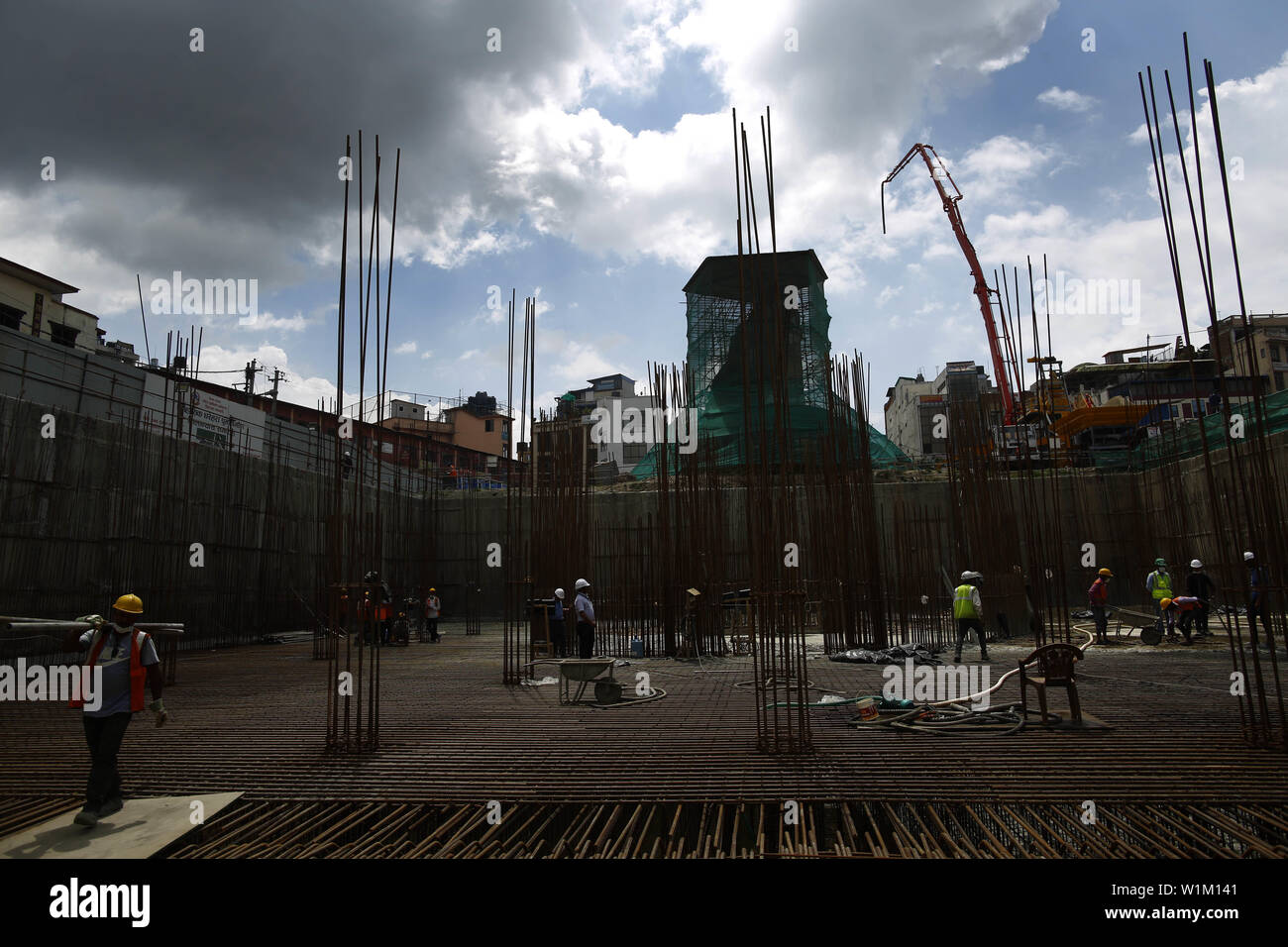 Kathmandu, Nepal. 3rd July, 2019. Workers work on the reconstruction ...
