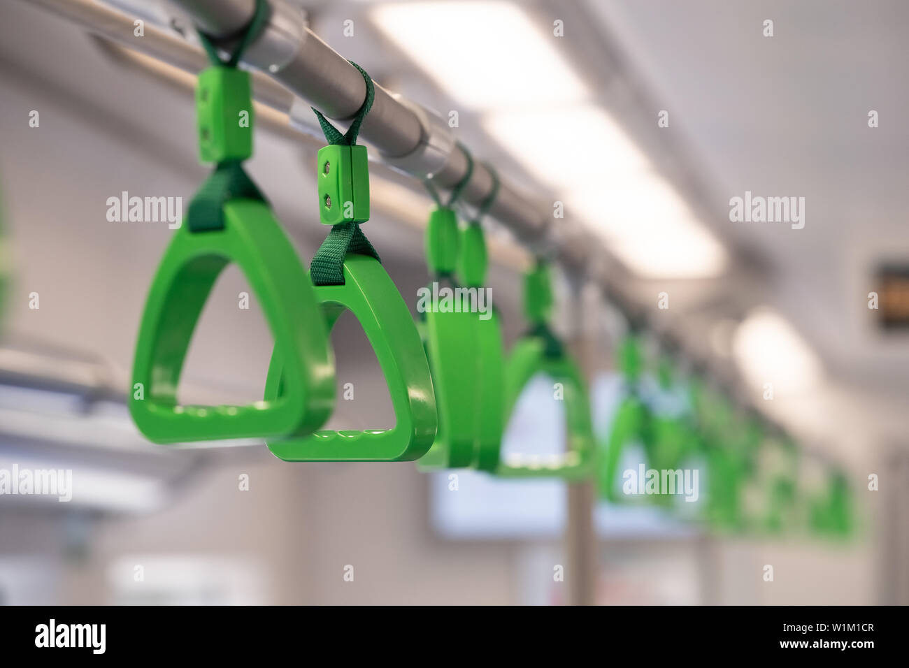 Handles standing passenger inside bus transportation hi-res stock ...
