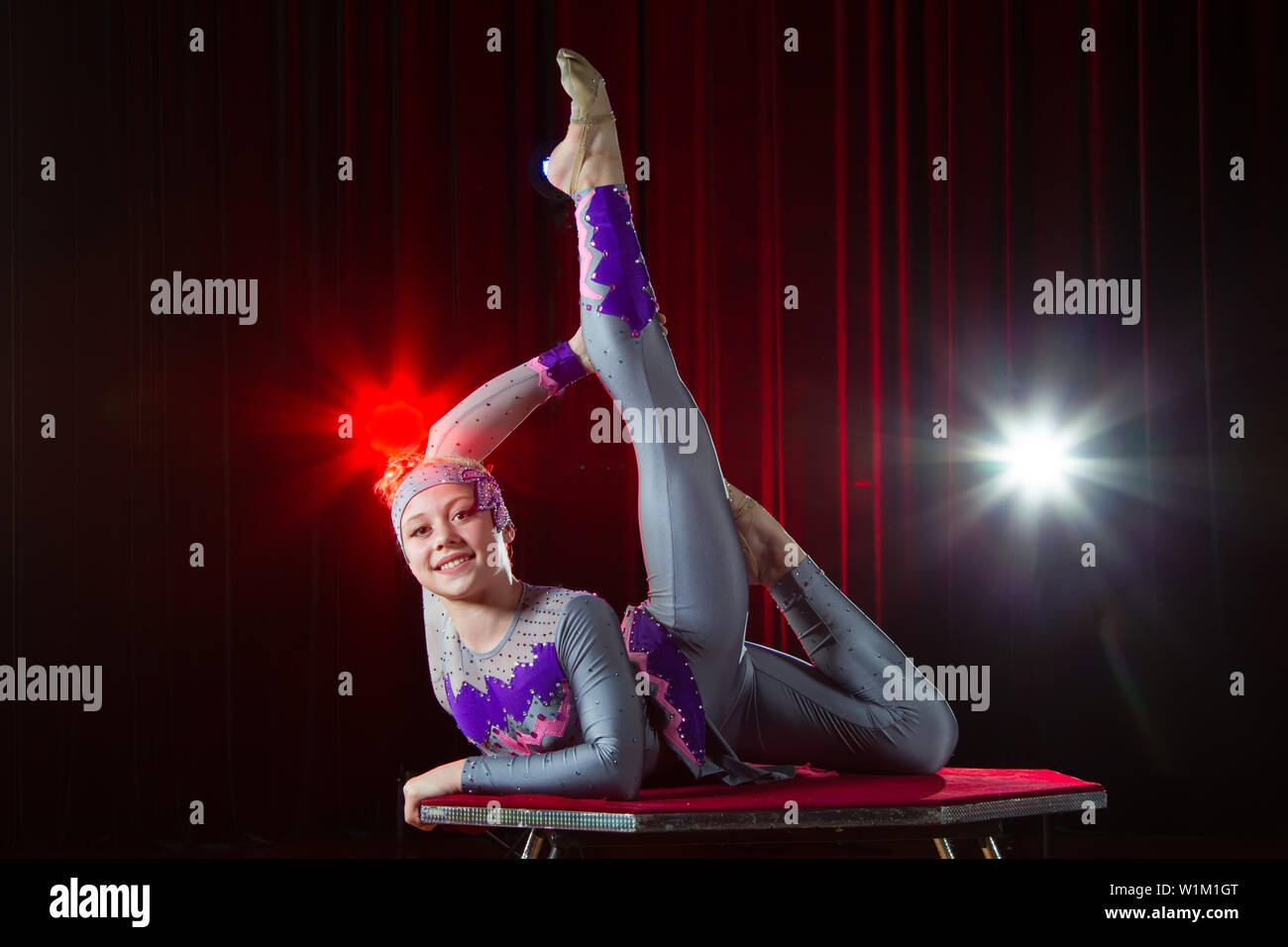 A girl with a flexible body. Performs a circus artist. Circus gymnast ...