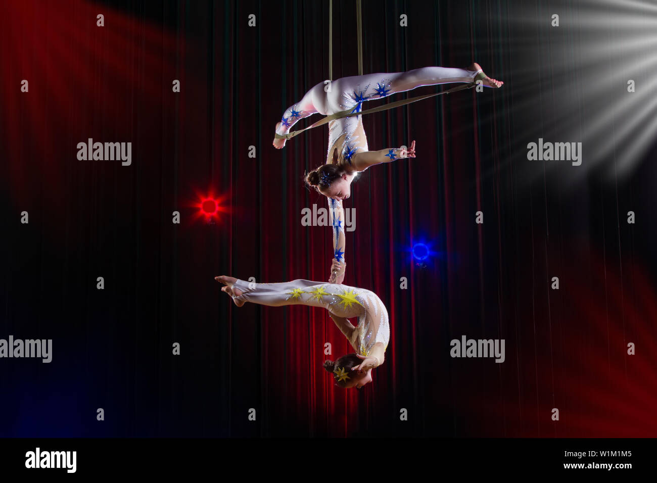 Circus actress acrobat performance. Two girls perform acrobatic ...
