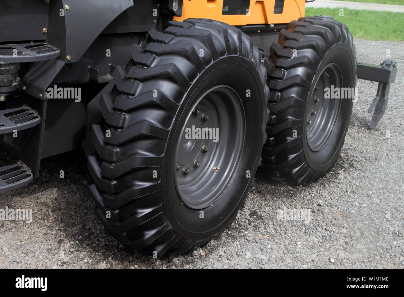 Wheels with a high protector of a modern tractor Stock Photo - Alamy