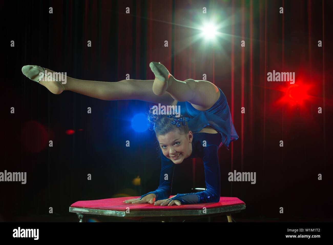 A girl with a flexible body. Performs a circus artist. Circus gymnast ...