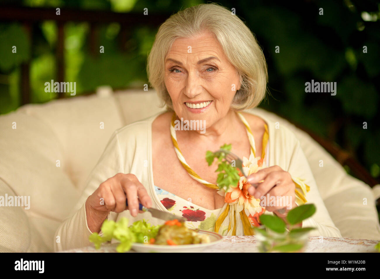 Old lady eating breakfast hi-res stock photography and images - Alamy