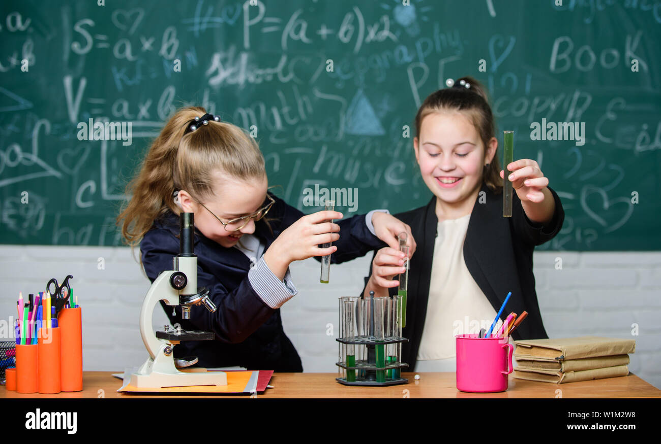 Really busy. Little girls in school lab. Science is future. Little ...