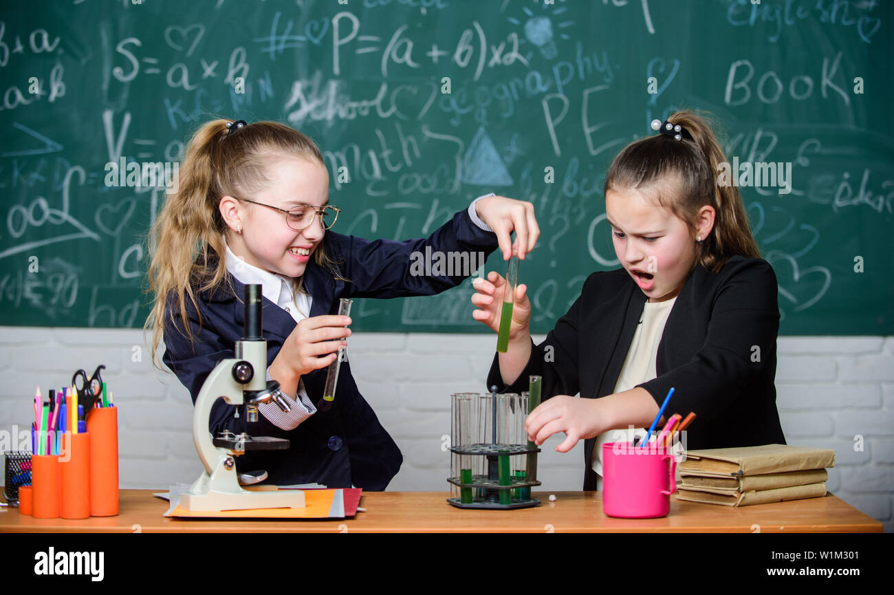 Microscope and test tubes on table. Educational experiment concept. Be ...