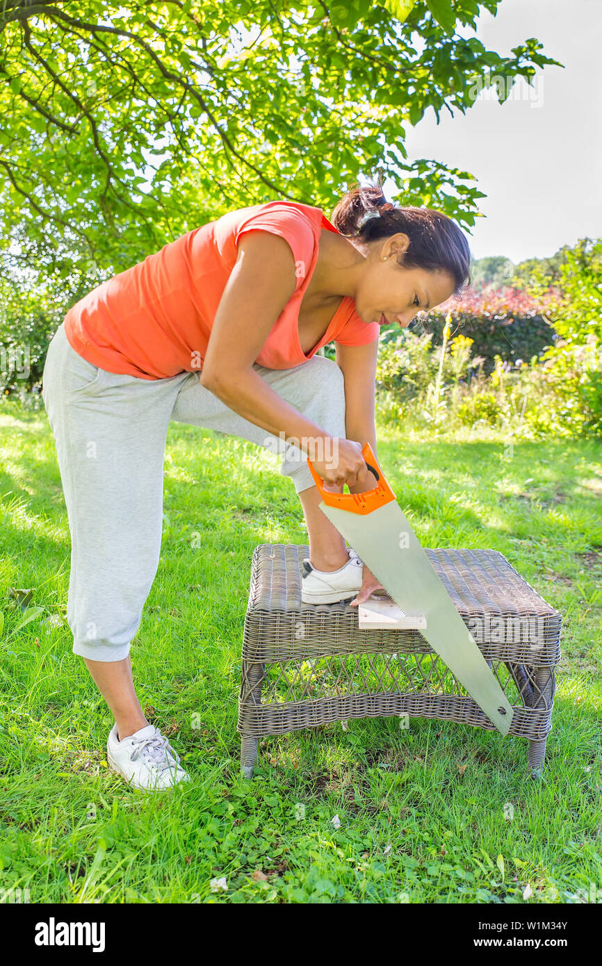 Hand sawing wood outside hi-res stock photography and images - Alamy