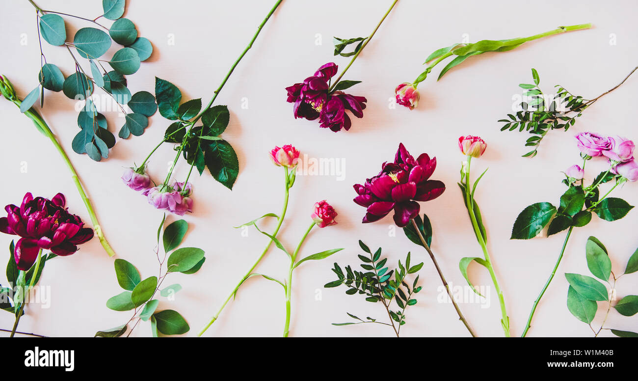 Flat-lay of various summer flowers over pink background Stock Photo - Alamy