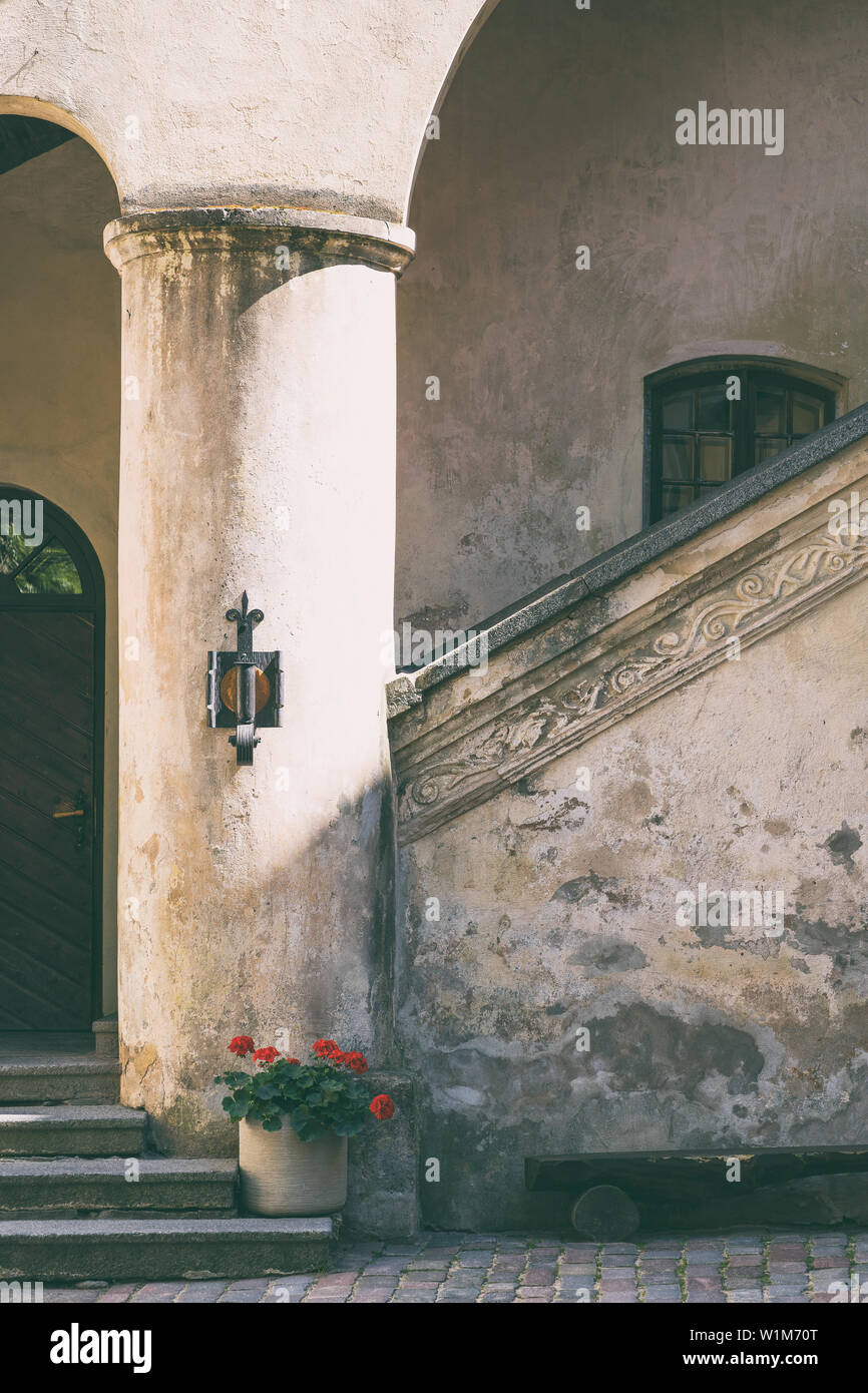 Fragment of the interior courtyard of an ancient castle with columns ...