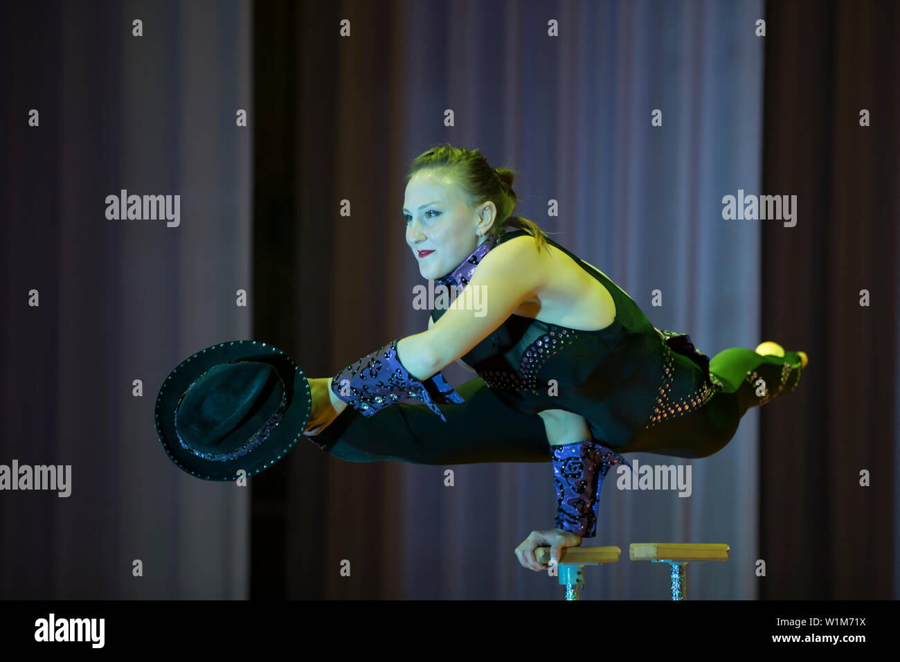 .Acrobatic performance of the actress.Girl with a flexible body ...