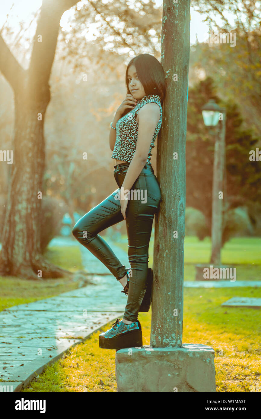 Young girl modeling in park Stock Photo - Alamy