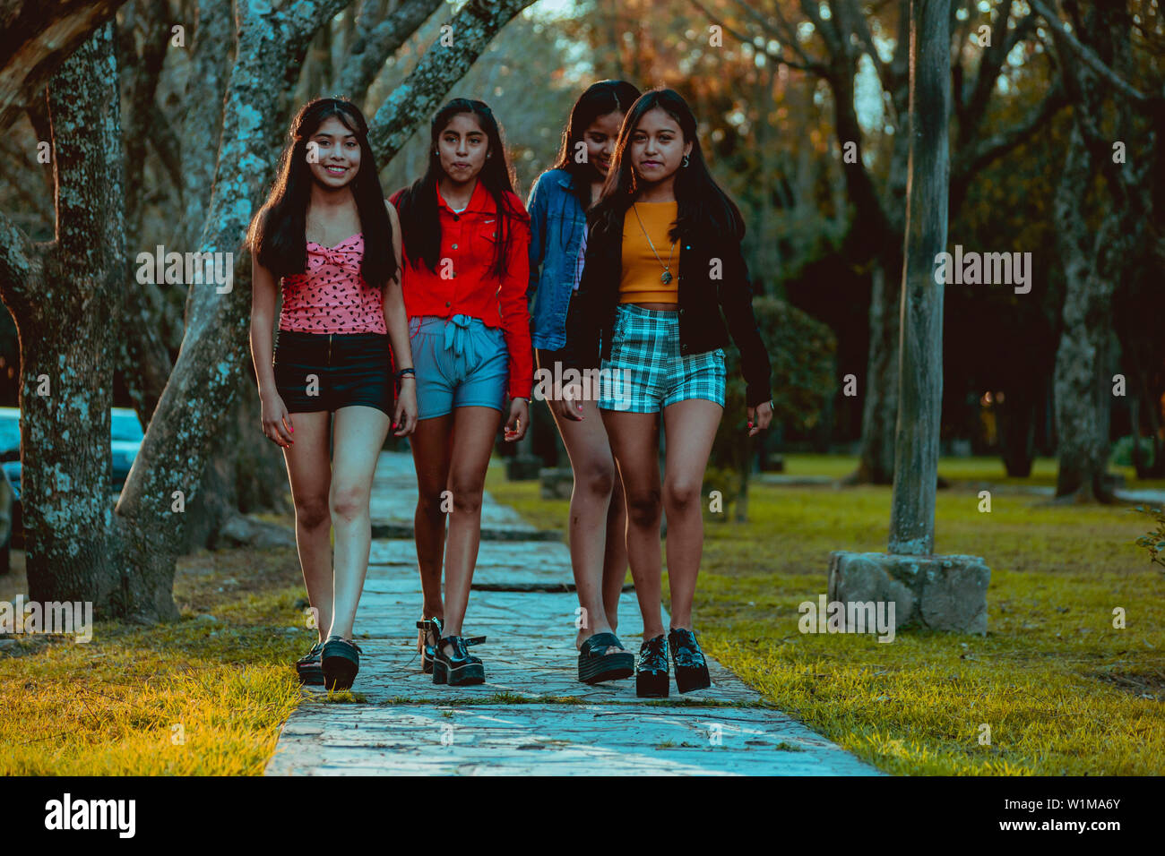 Girls playing in park hi-res stock photography and images - Alamy