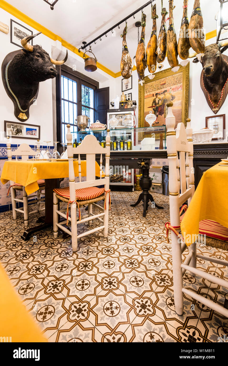 A typical traditional restaurant with ham and decorations in the ...