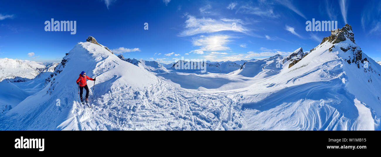 Panorama with woman back-country skiing, view to Monte Soubeyran and ...