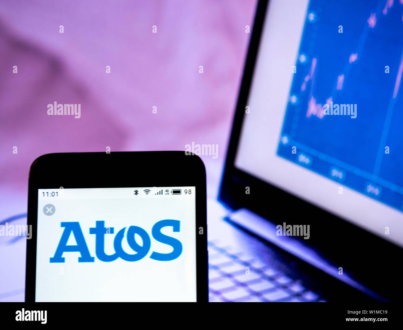 In this photo illustration the Atos logo is seen displayed on a smartphone Stock Photo - Alamy