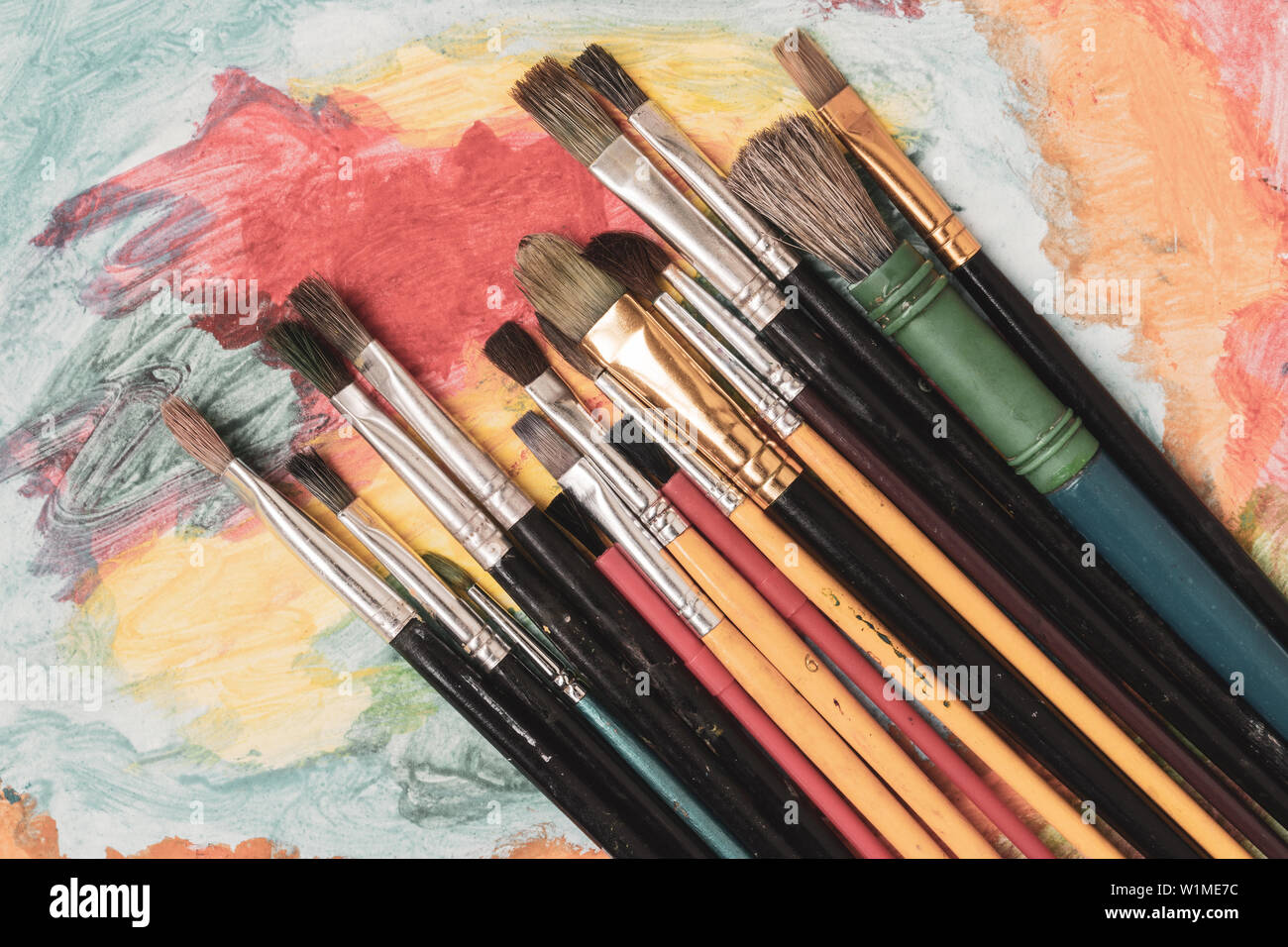 Vintage tools brushes on artistic painting background Stock Photo - Alamy