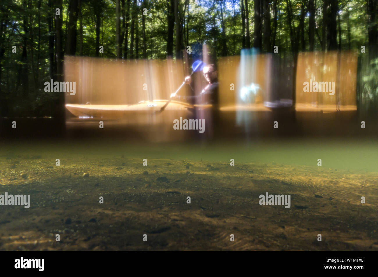 Kayak tourist paddling through the Spreewald biosphere reserve ...