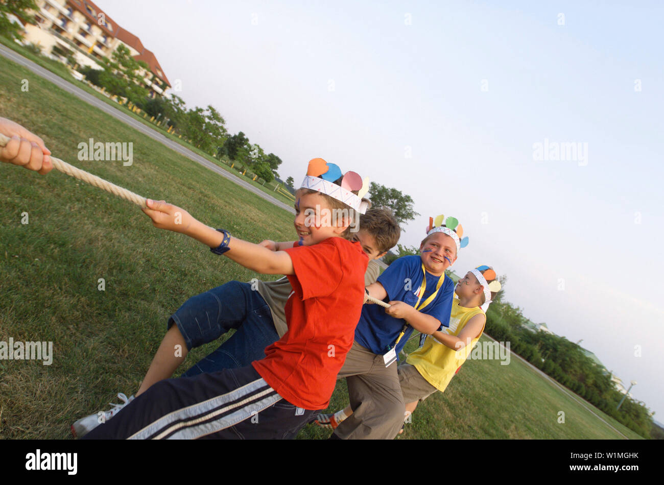 Children pulling cord, people pulling cord Stock Photo - Alamy