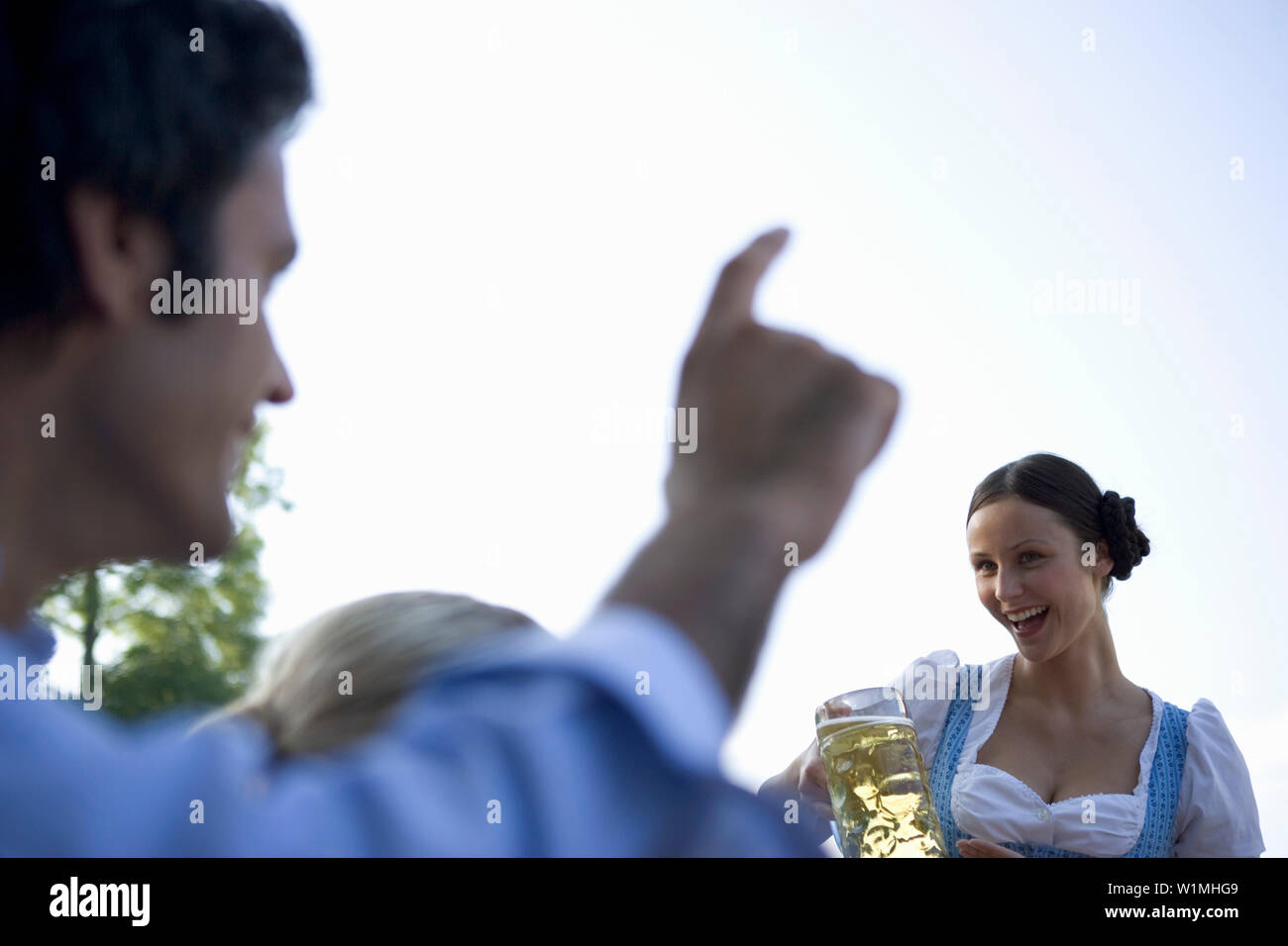 Woman serving a man beer hi-res stock photography and images - Alamy