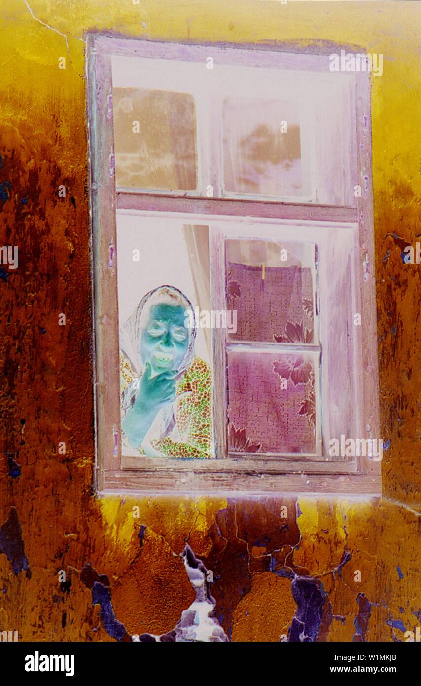 Old Lady in window, Bistritja Romania Stock Photo - Alamy