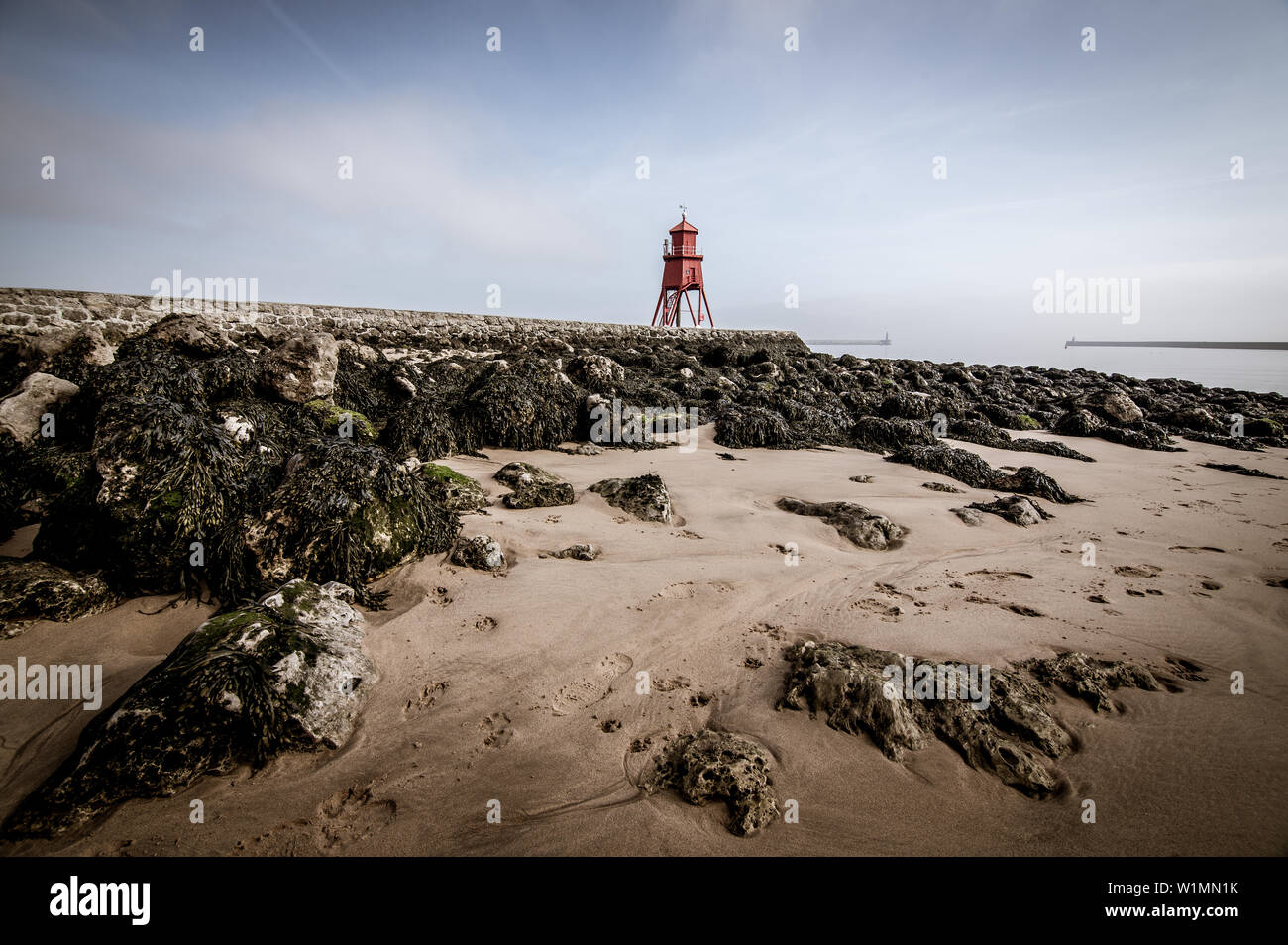 rock beach landscape sand lighthouse Stock Photo - Alamy