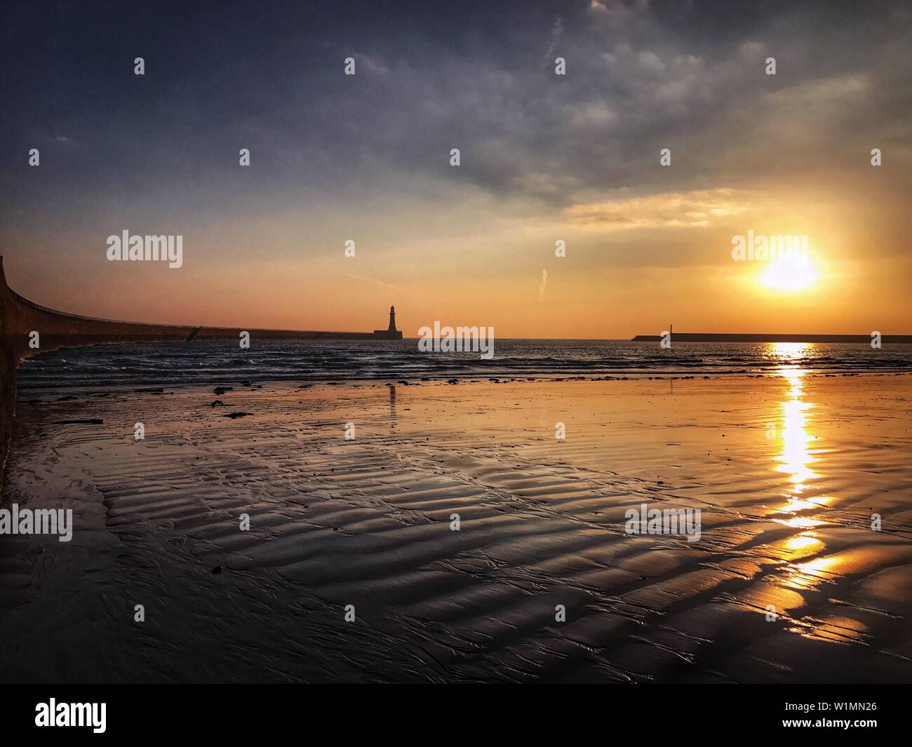 water sea sun sunset beach Stock Photo - Alamy