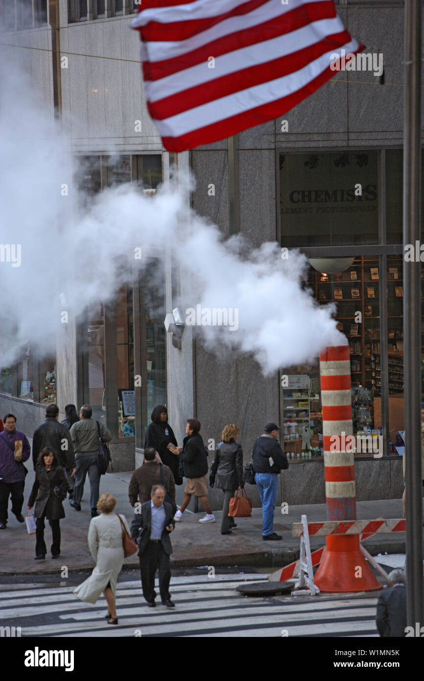 Diverting steam on a Manhattan street. The underground steam network is ...