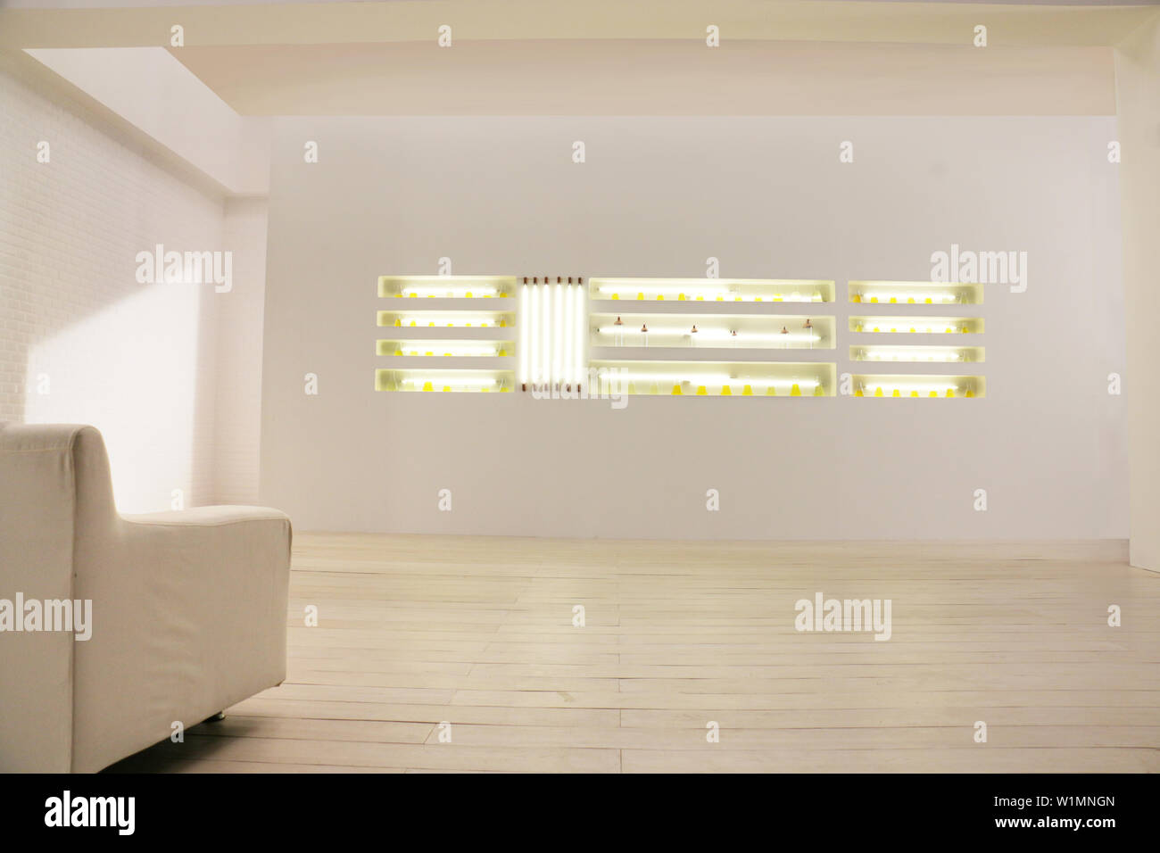 a empty lobby room has bright shelf on the wall put some decorations ...