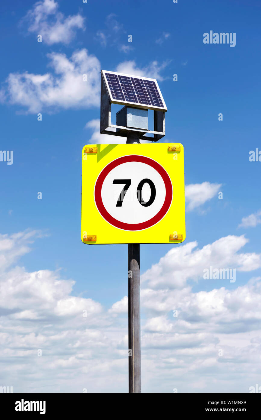 Road sign with lighting and solar powered Stock Photo - Alamy