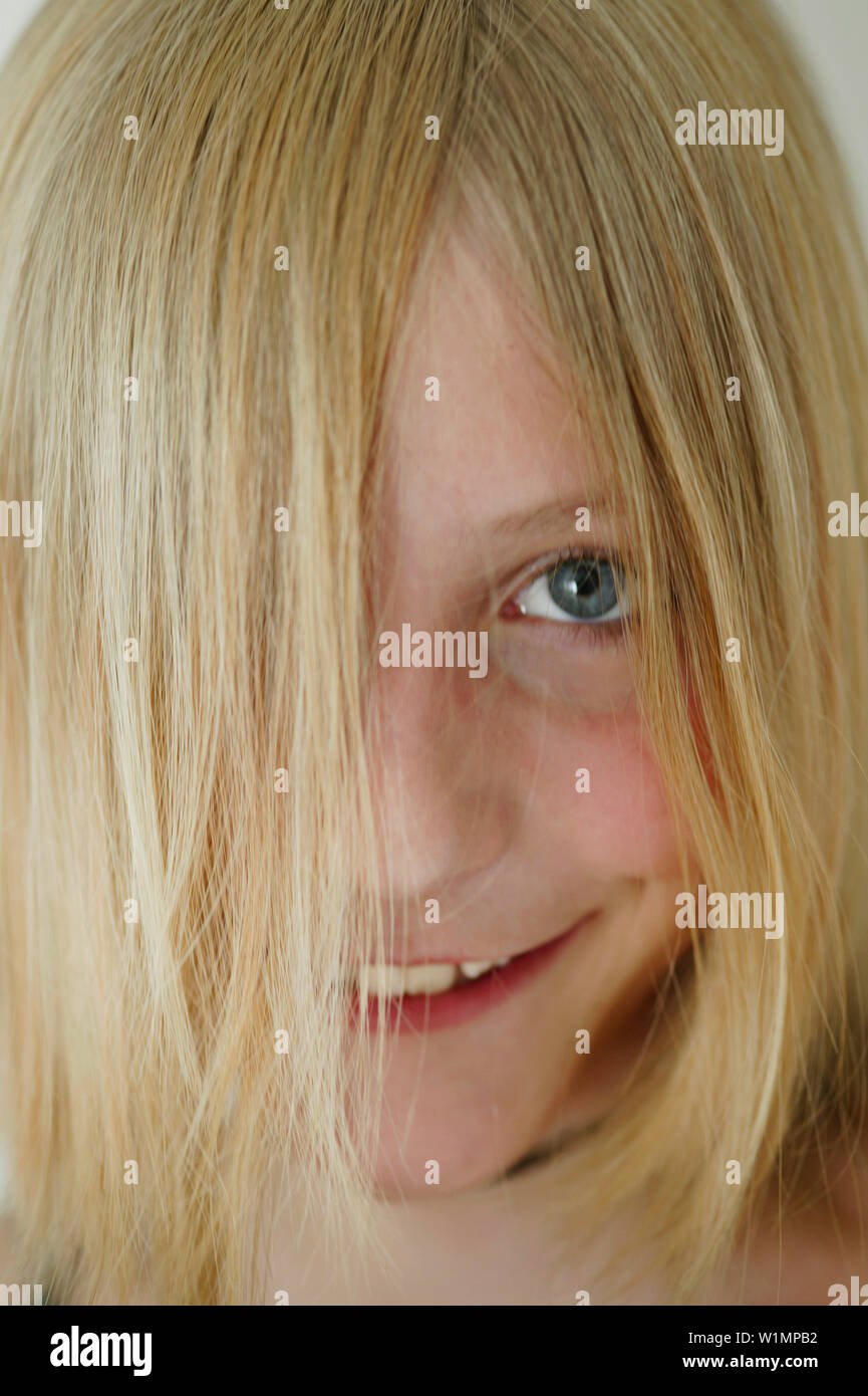 Girl (12 years) with hair covering face Stock Photo - Alamy