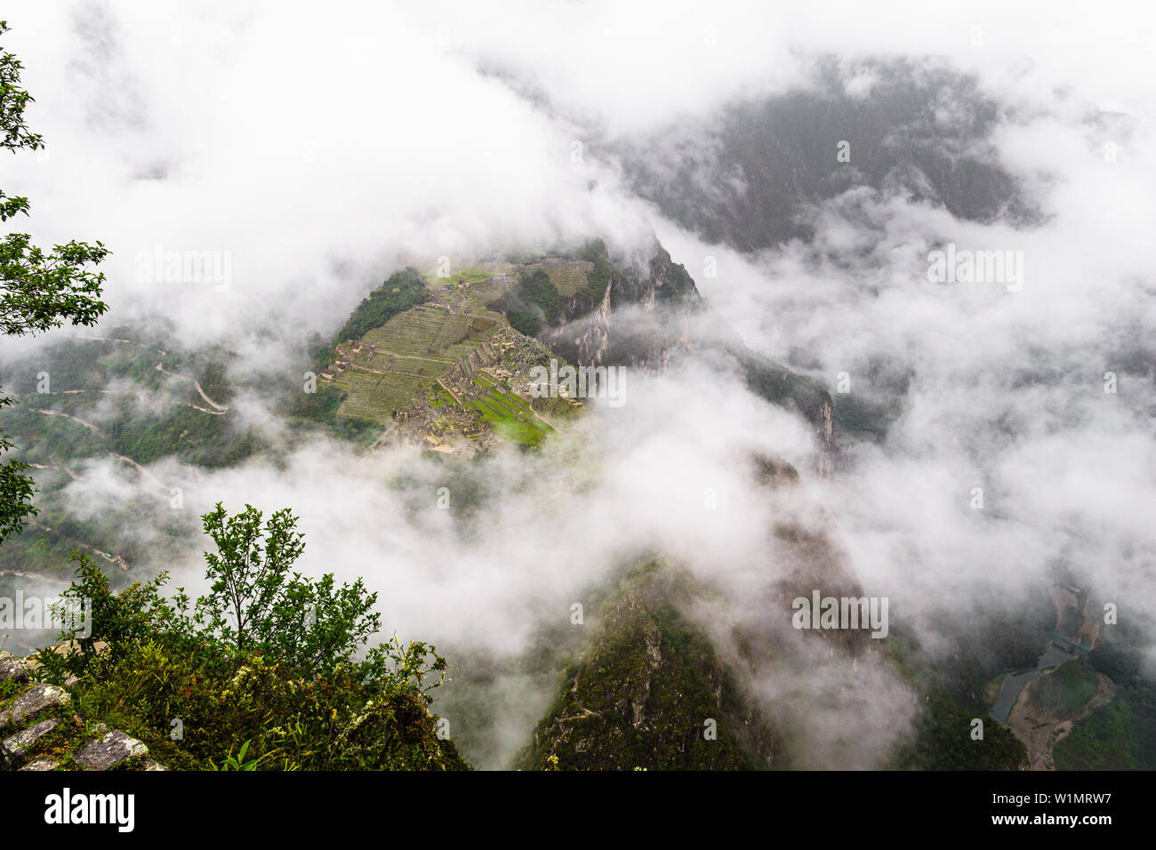 Waiting for a clear view at the top of Wayna Picchu, Peru Stock Photo ...