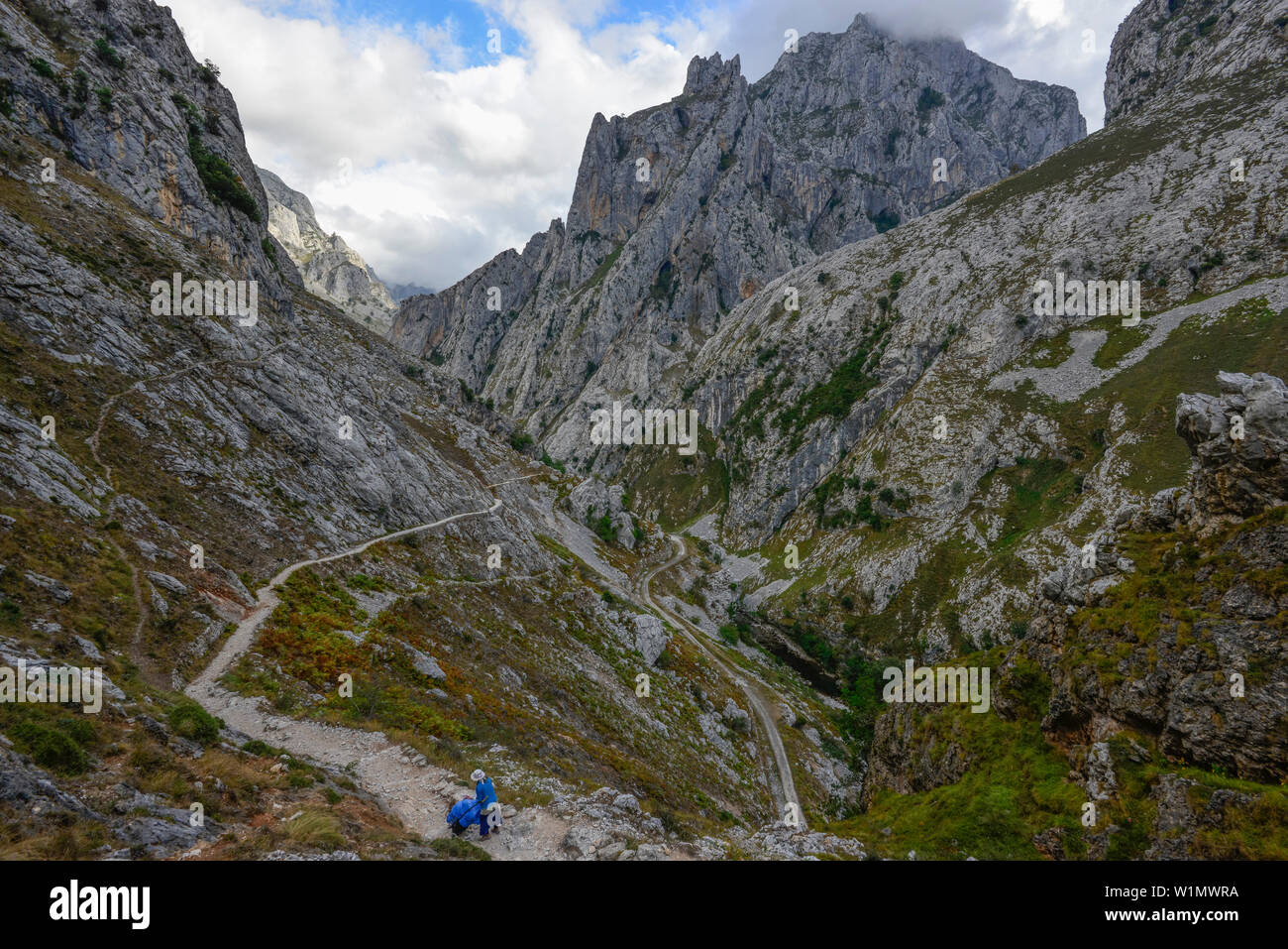 old woman is hiking on trail Ruta del Cares from Bulnes and Poncebos ...