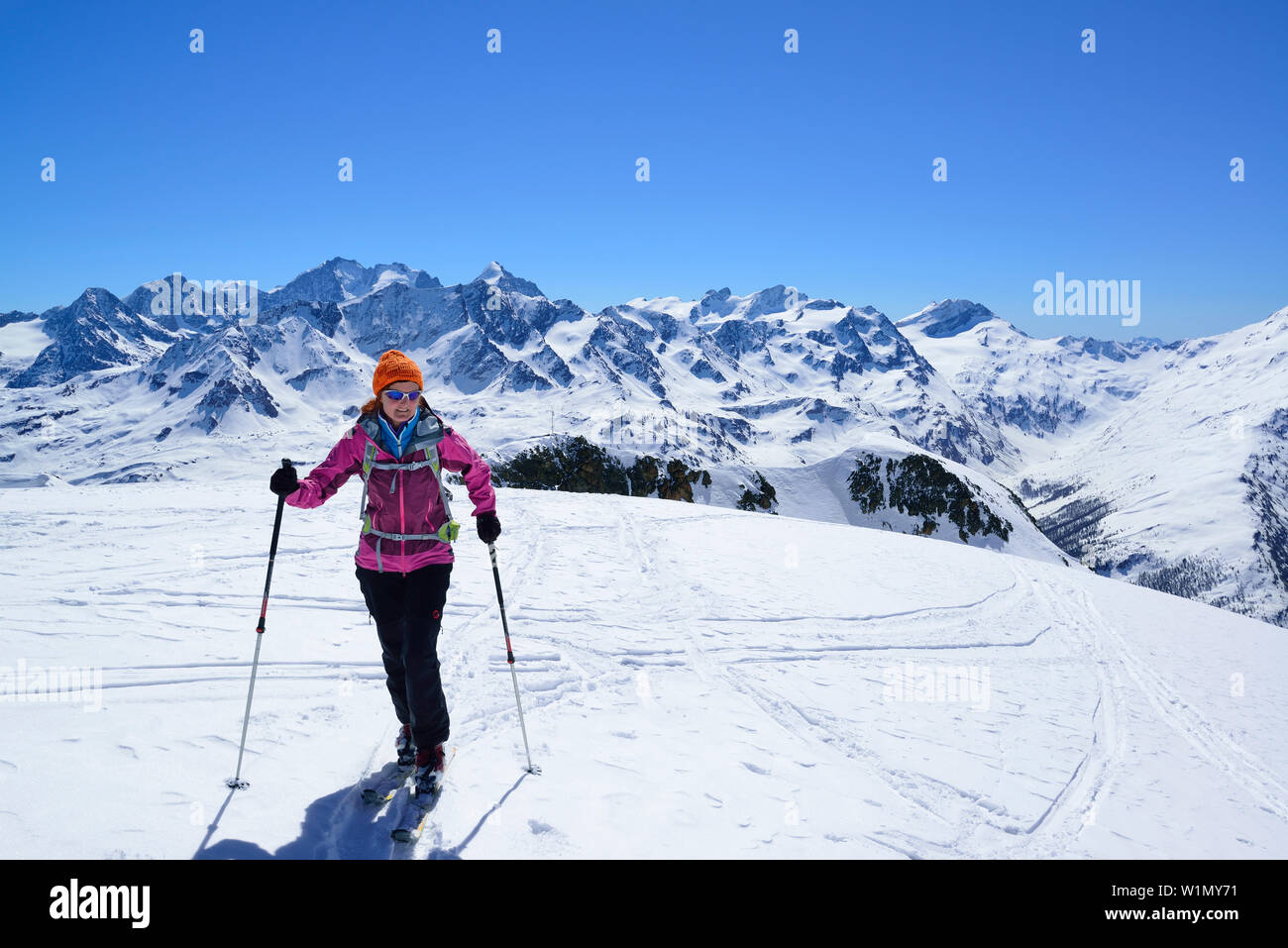 Female back-country skier ascending to Piz Lagrev, Bernina Range in ...