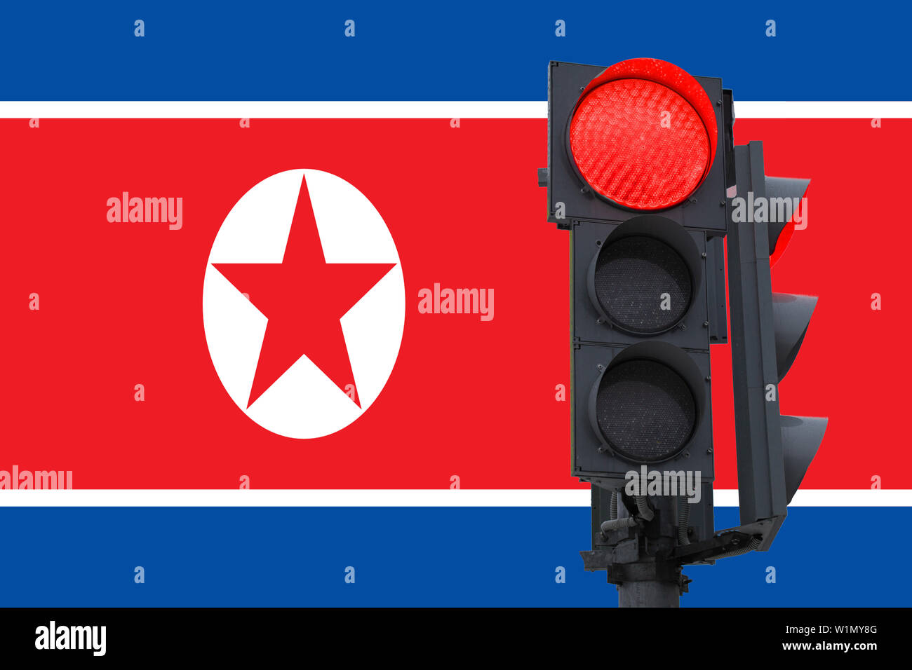 traffic light with a burning prohibitory signal. against the background ...
