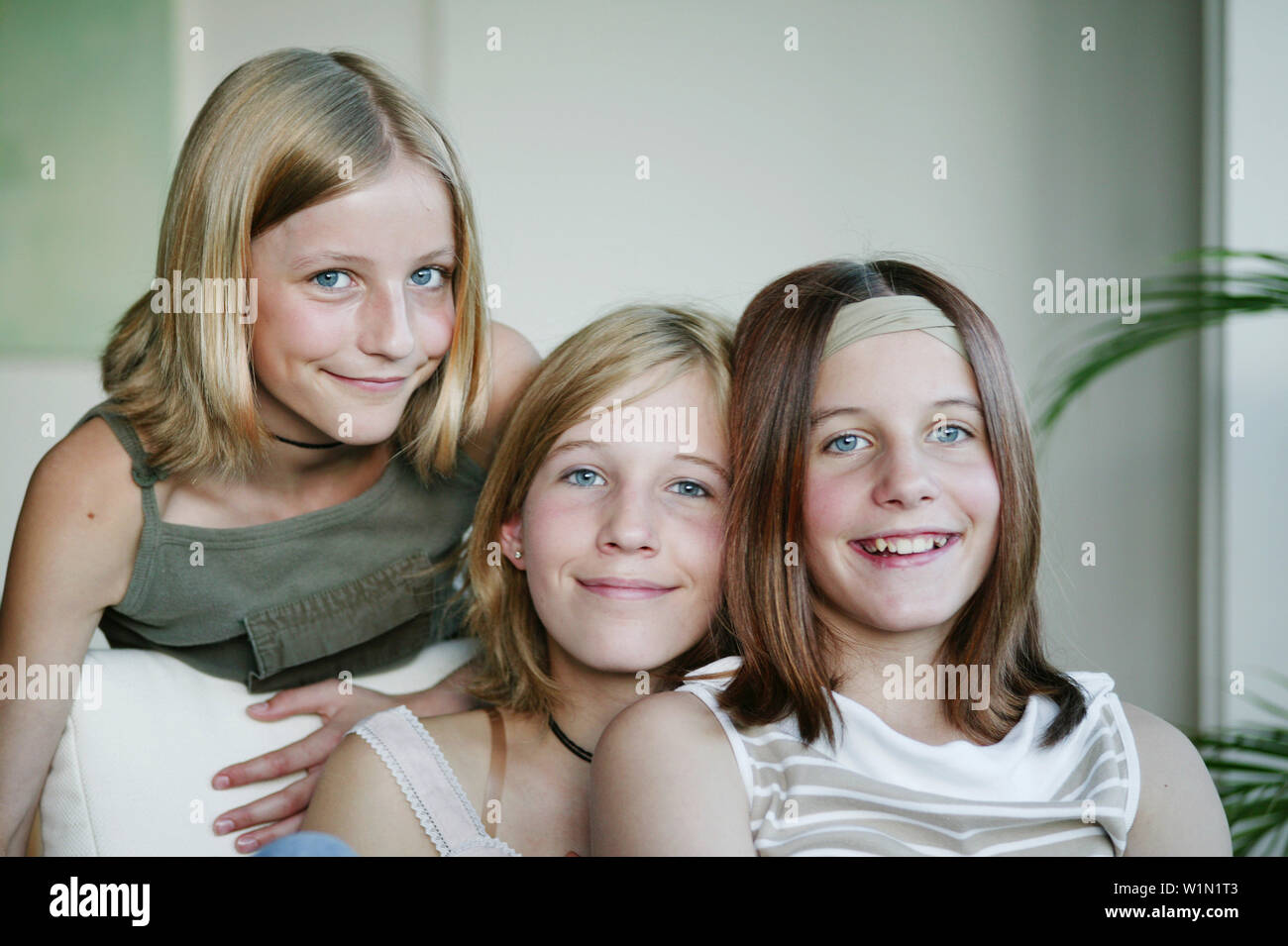 Three girls (12-15 years) smiling at camera Stock Photo - Alamy
