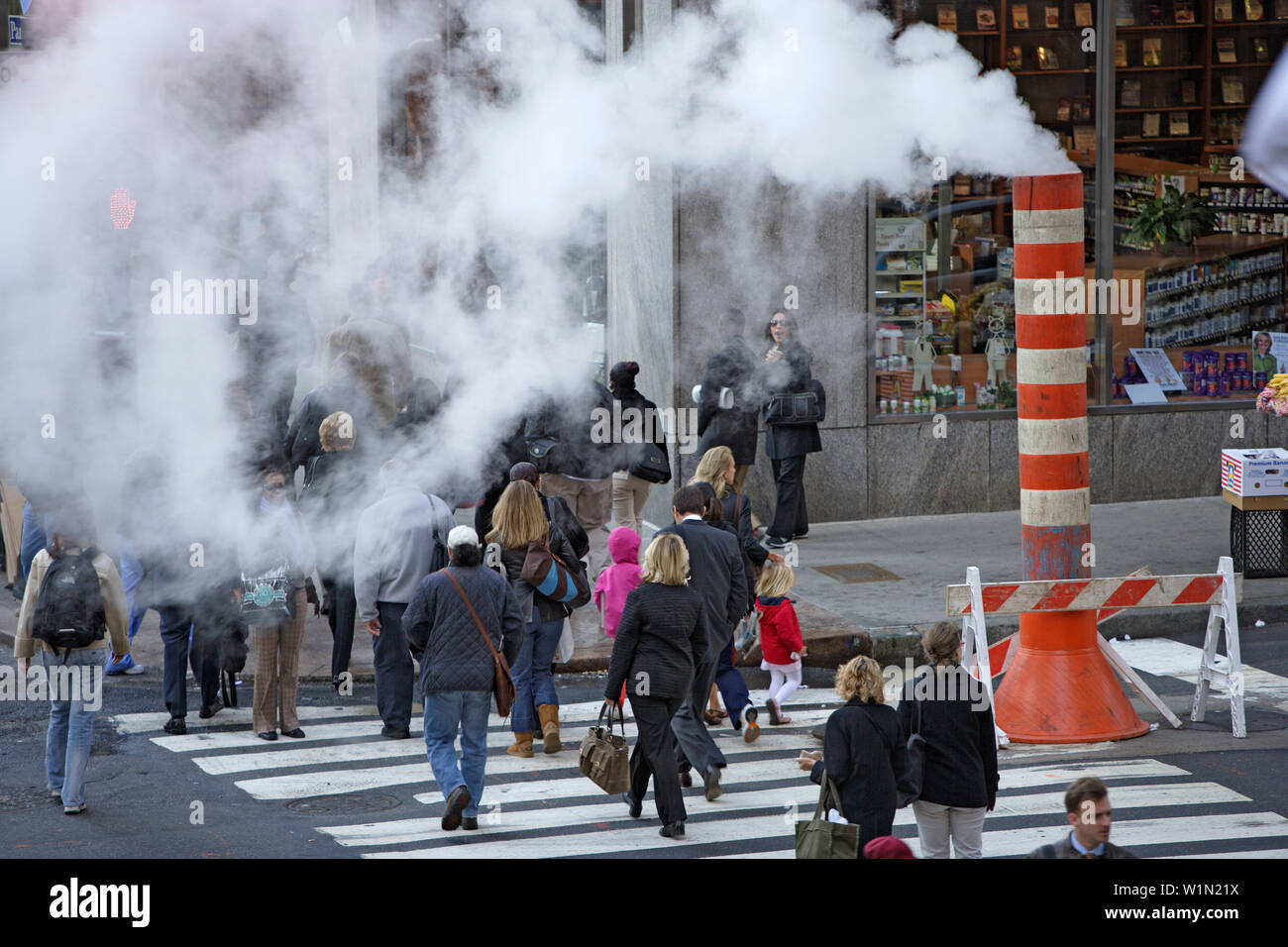 Diverting steam on a Manhattan street. The underground steam network is ...