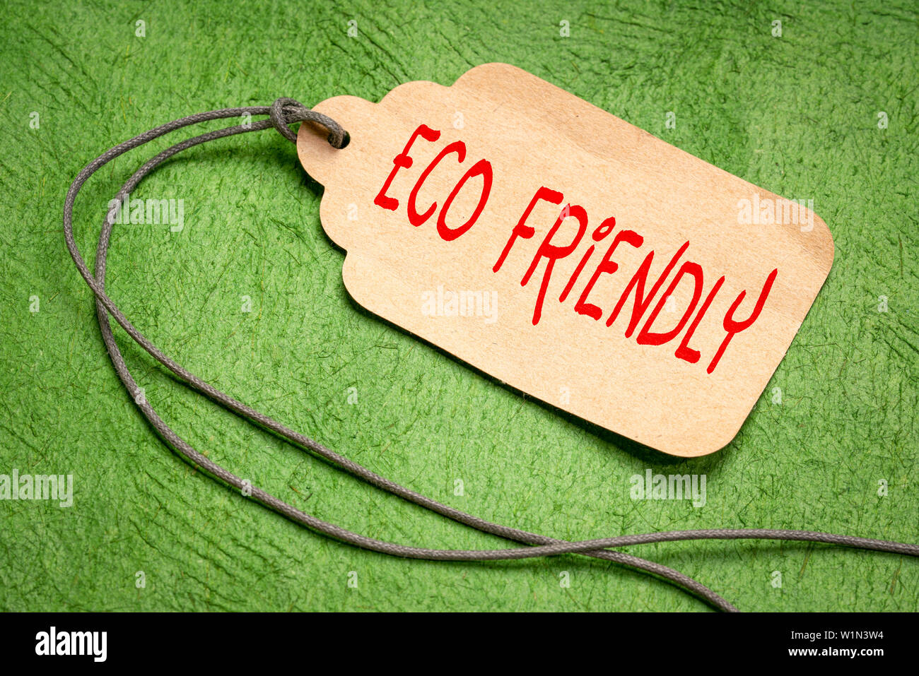 eco friendly sign - handwriting on a price tag with a twine against ...