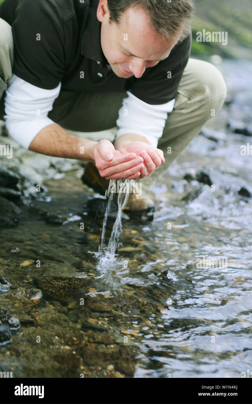 Man drinking water from river hi-res stock photography and images - Alamy