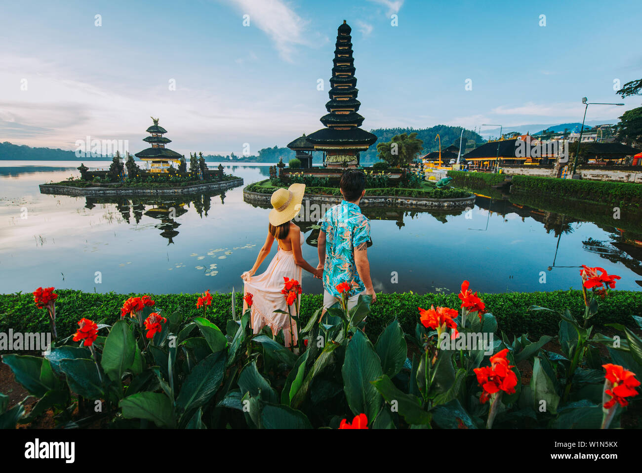 Couple spending time at the ulun datu bratan temple in Bali. Concept ...