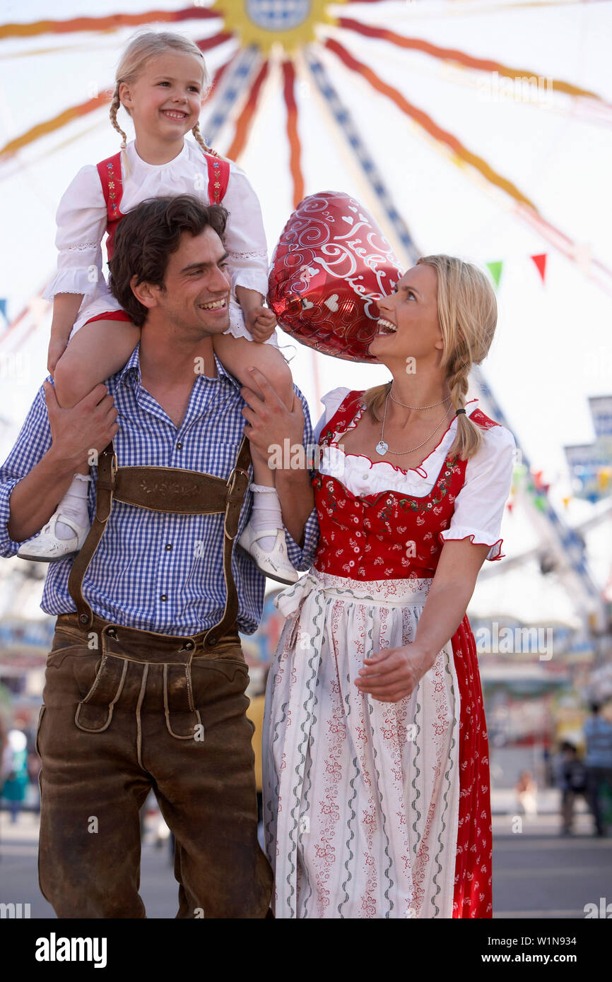 Family enjoying fun fair Stock Photo - Alamy