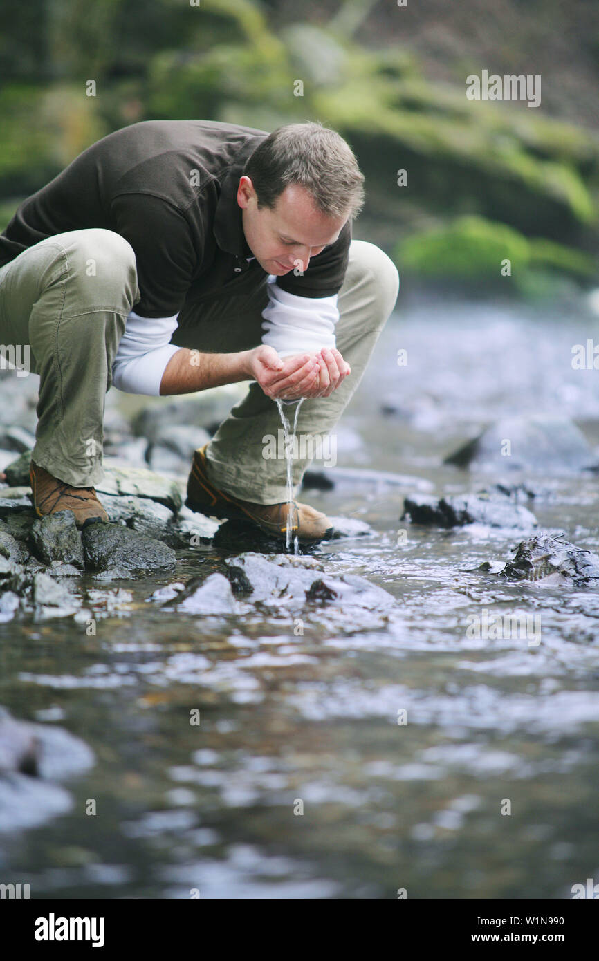 Man drinking water from river hi-res stock photography and images - Alamy