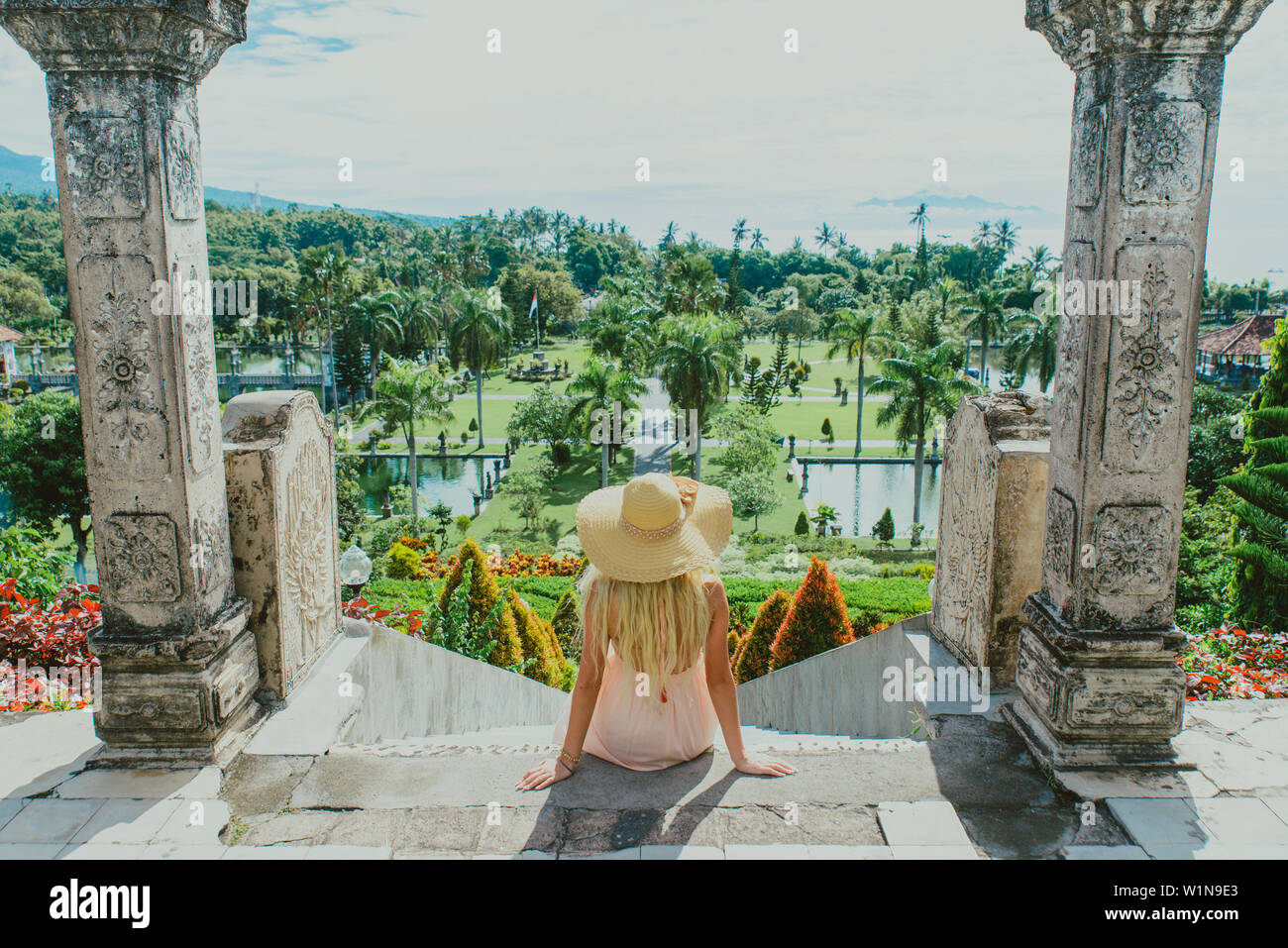 Beautiful caucasian girl visiting the water palace in Bali Stock Photo ...