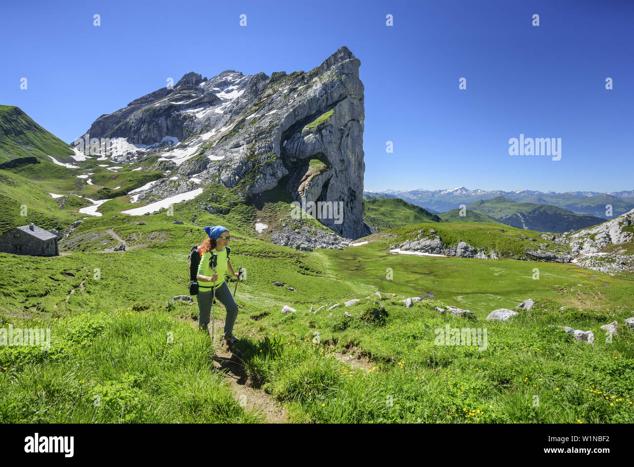 Woman hiking with view to Schweizer Tor, Schweizer Tor, Raetikon trail ...