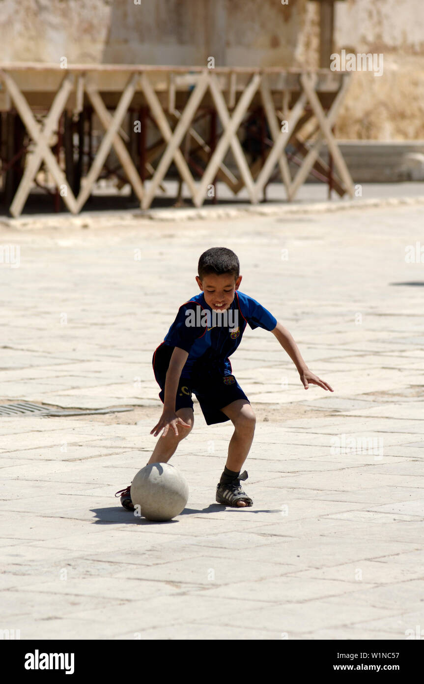 Boy playing football, Place el Hedim, Meknes, Morocco Stock Photo - Alamy