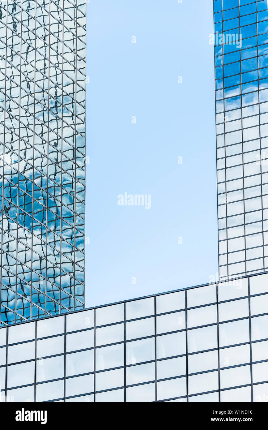 The glass facade one of many modern high-rise office blocks in the city ...