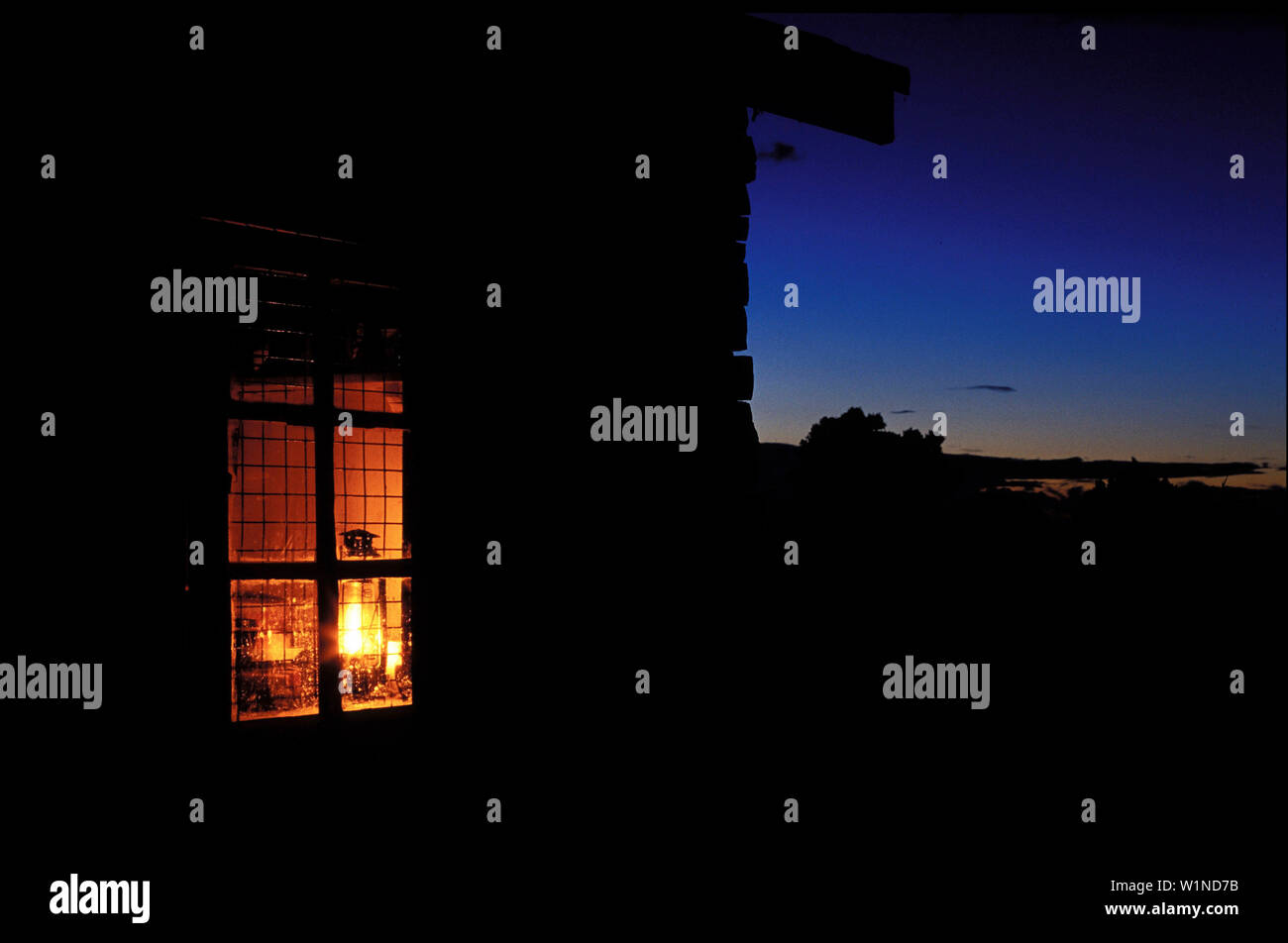 Illuminated window at night, landscape sunset Stock Photo - Alamy