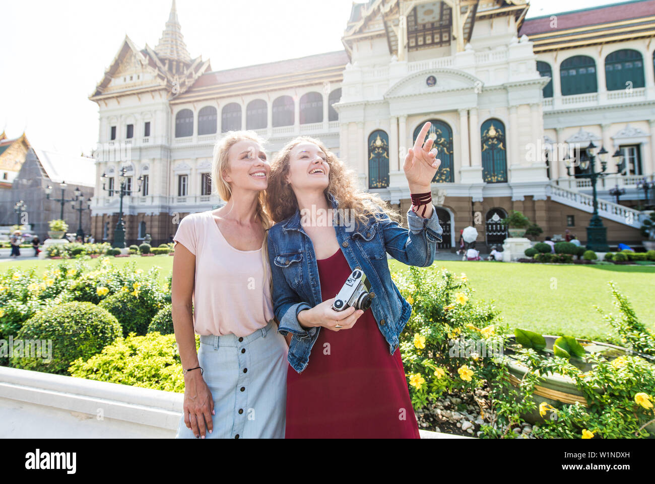Couple of beautiful girls visiting bangkok maining attractions Stock ...