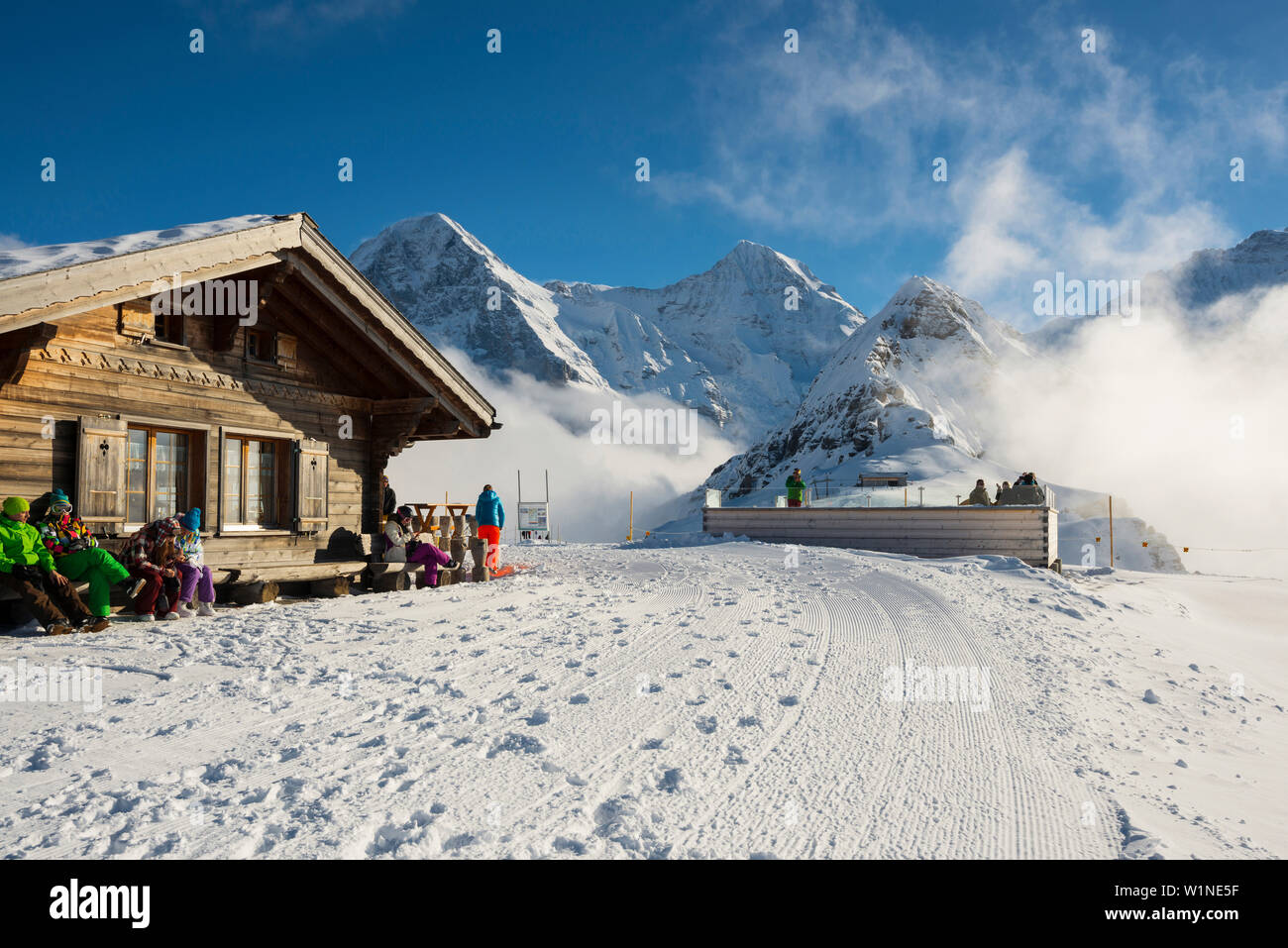 Timber hut in Winter on Maennlichen mountain with Eiger Moench and ...